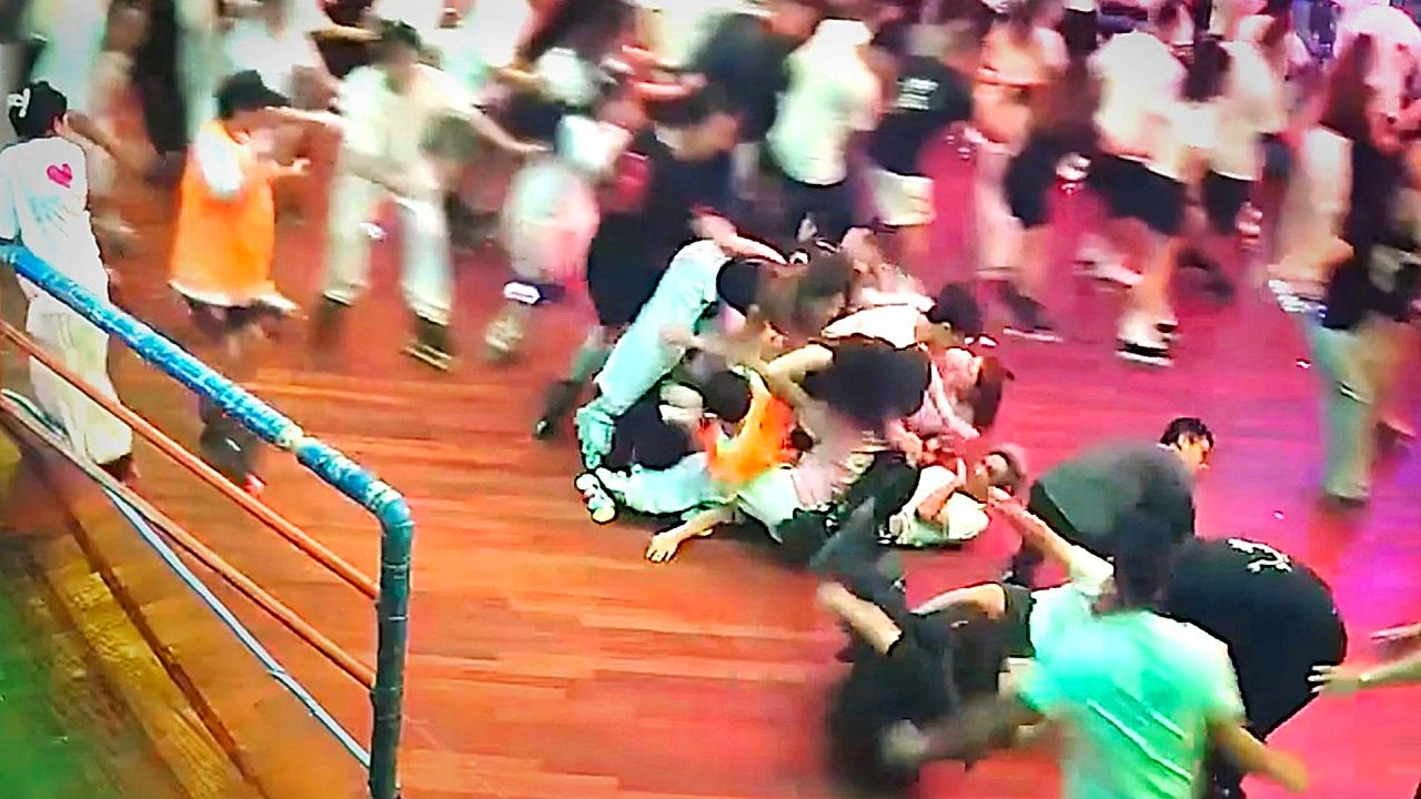 Falling like dominoes! Roller rink chaos as skaters cause mass pileup