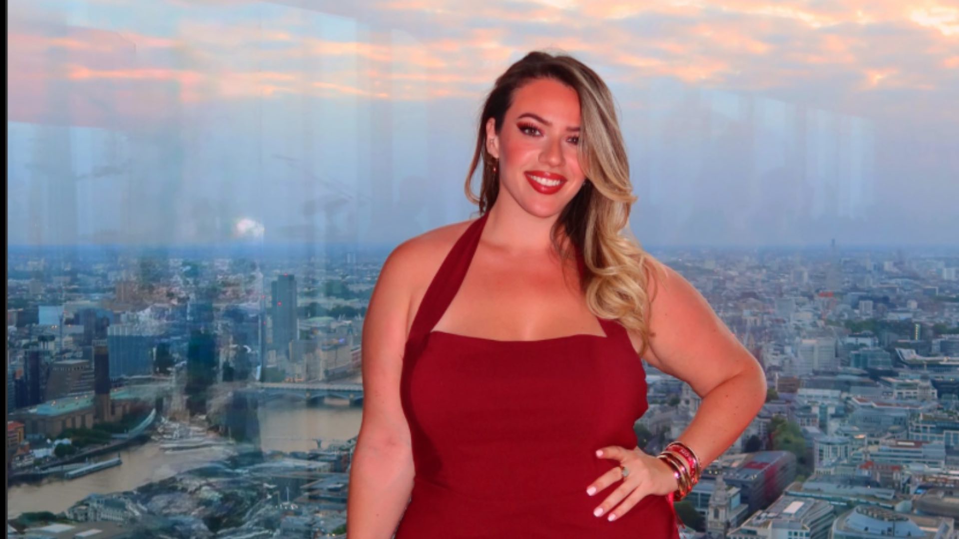 This size 16 influencer makes a splash in a red dress