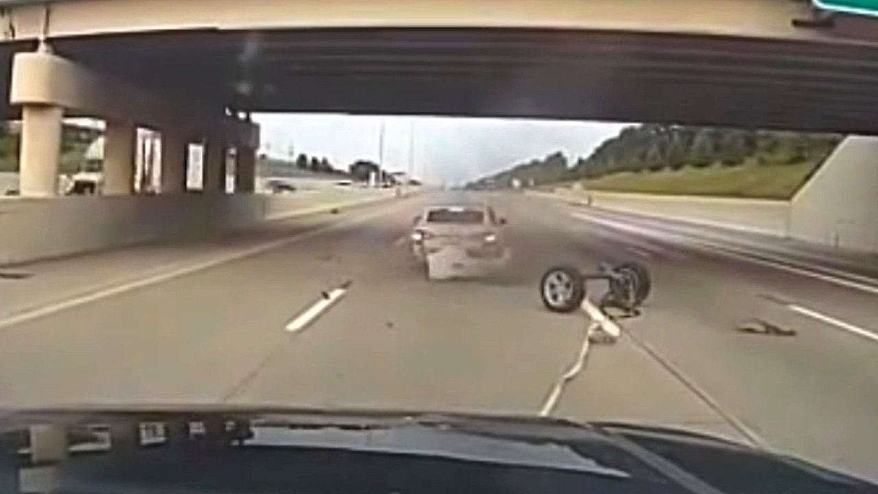 Police grappler rips rear axle off stolen car in Michigan chase