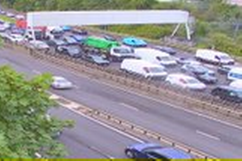 Firefighters rescue person from 'crushed' van after Glasgow M8 crash