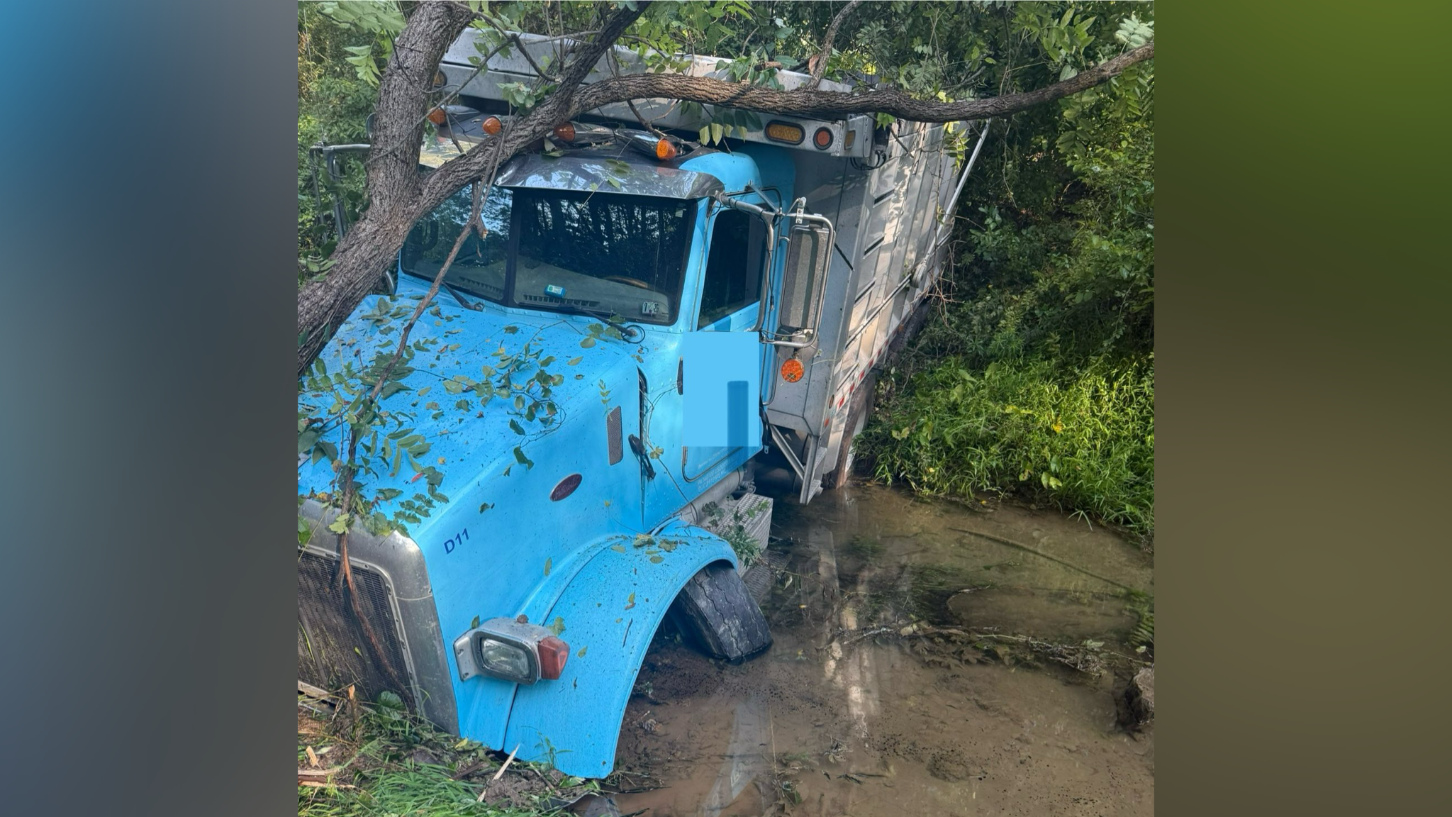 Driver jumps out of dump truck going down 200-foot embankment into ...