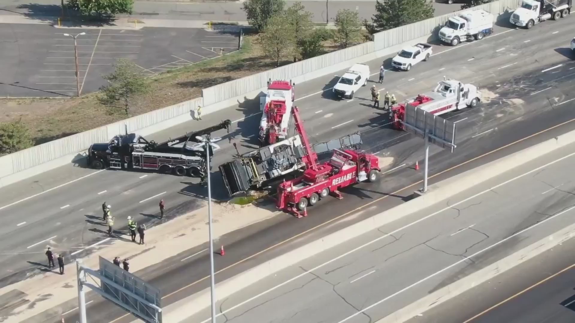 80,000-pound construction vehicle falls off truck on I-25