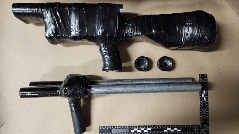 Two men arrested at Albion Park after police seize homemade 'slam guns'
