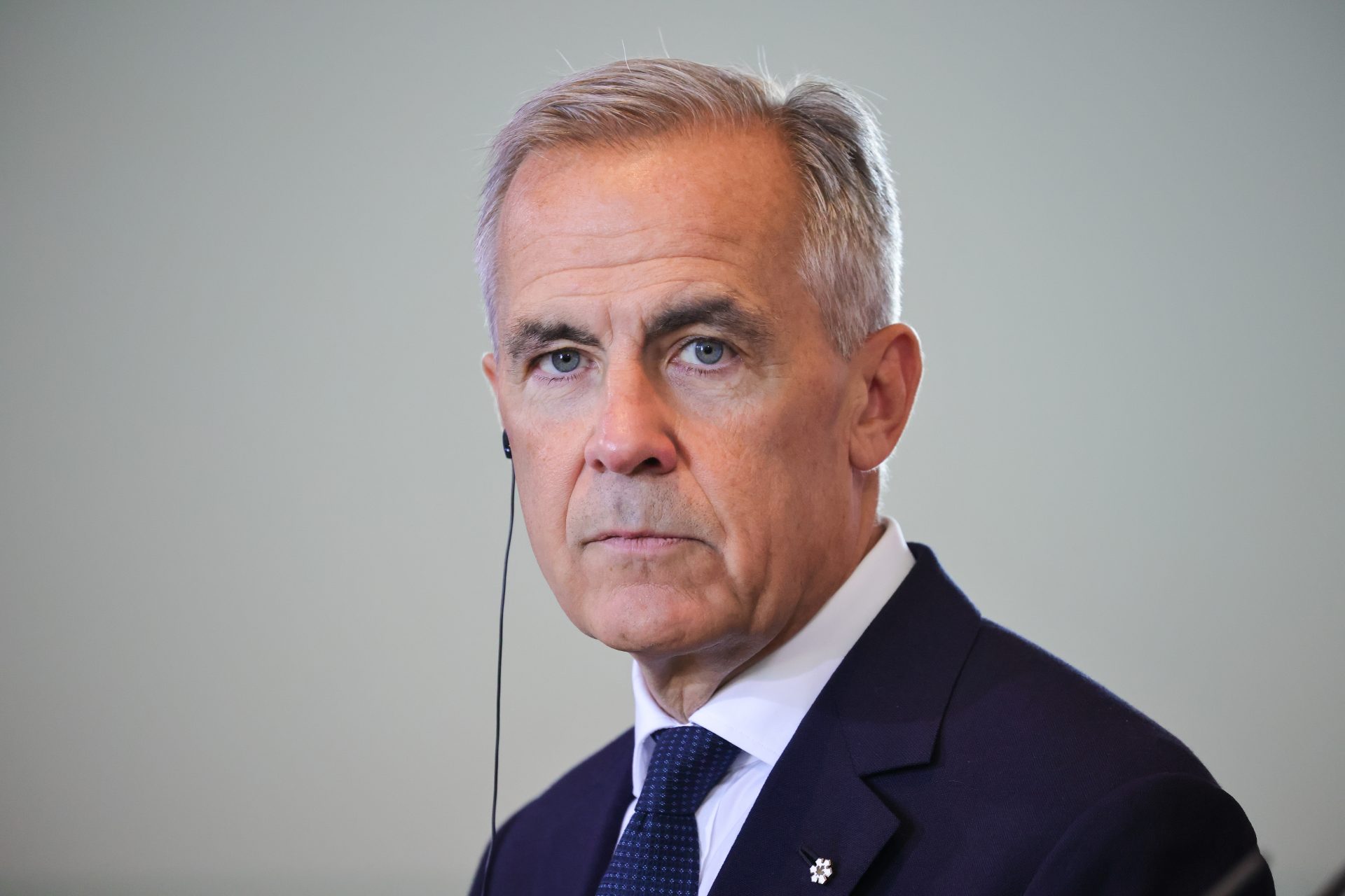 Donald Trump raises the stakes in feud with Mark Carney