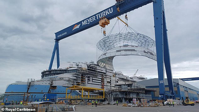 World's largest cruise ship makes a splash as it hits the water for the ...