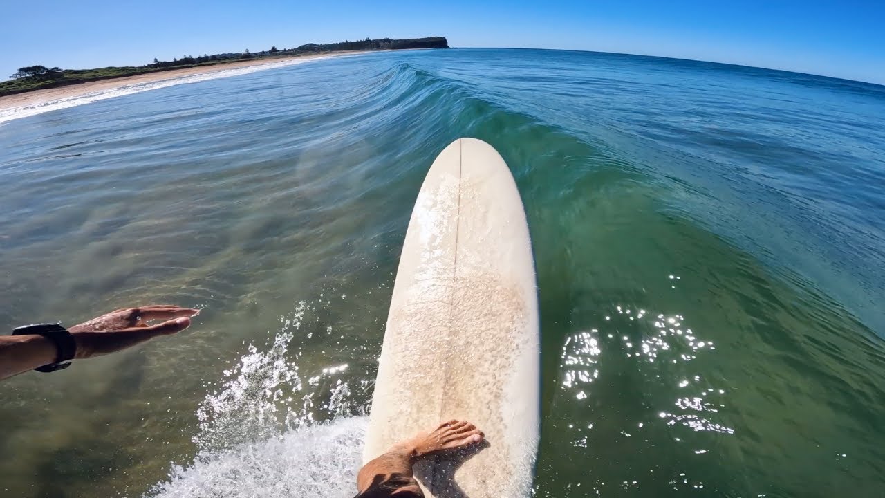 Longboard Surfing Crystal Clear Waves