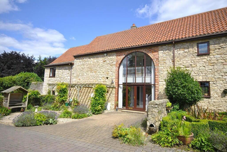 Inside this appealing stone barn conversion with gardens, for sale near ...