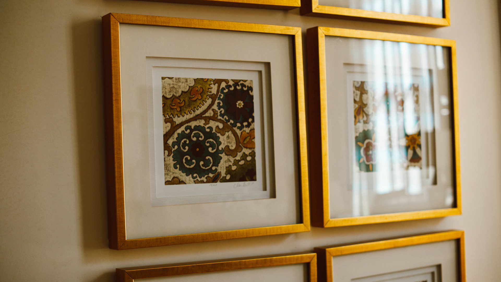5 Boomer-Framed Art Choices That Make Rooms Feel Busy