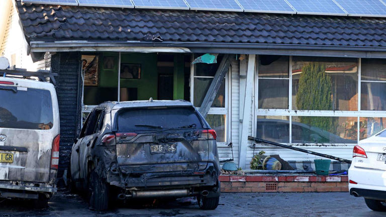 Four escape as home, cars go up in flames