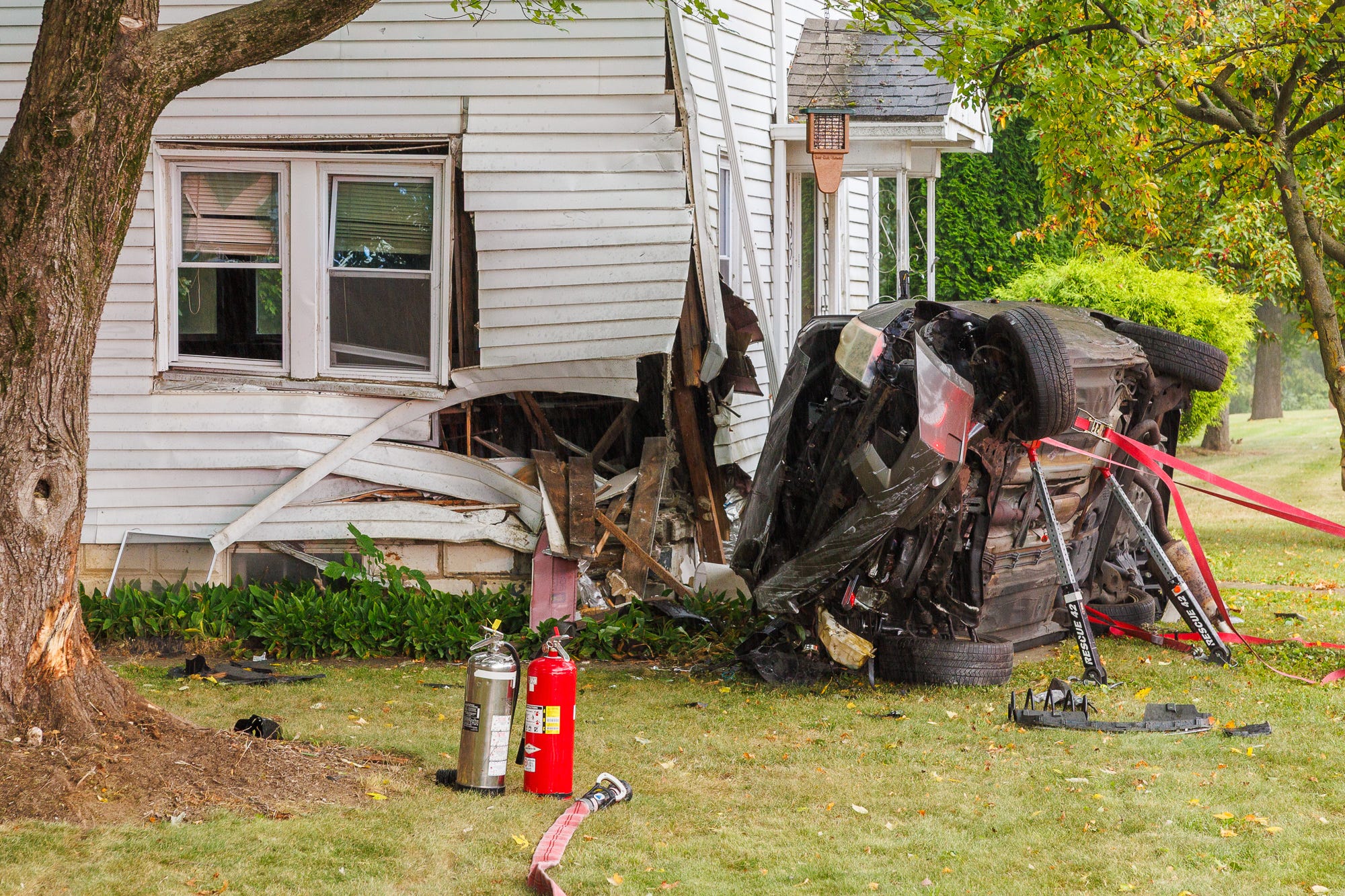 Driver injured, resident displaced after car rolls into Hanover home