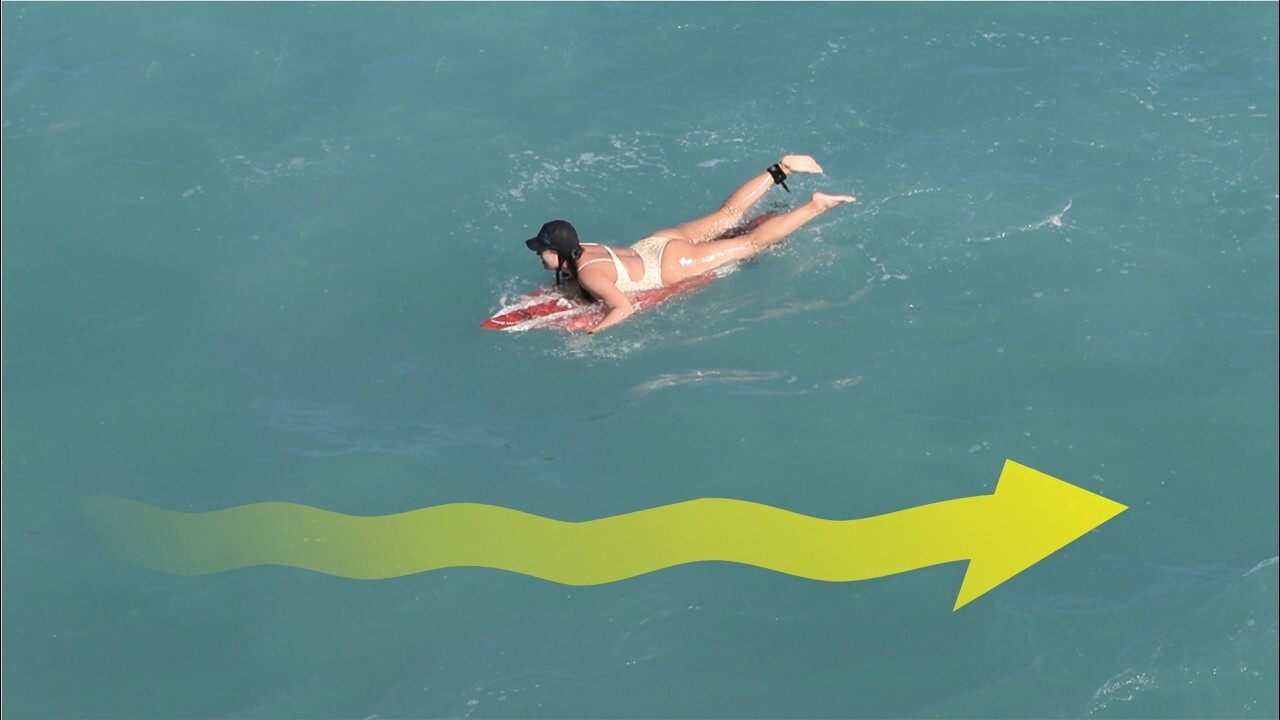 Surfers swept away by waves in Uluwatu's opening scene