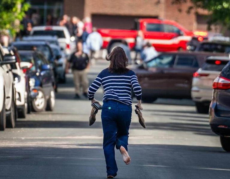 Barefoot mother's dash to school shooting stirs U.S.