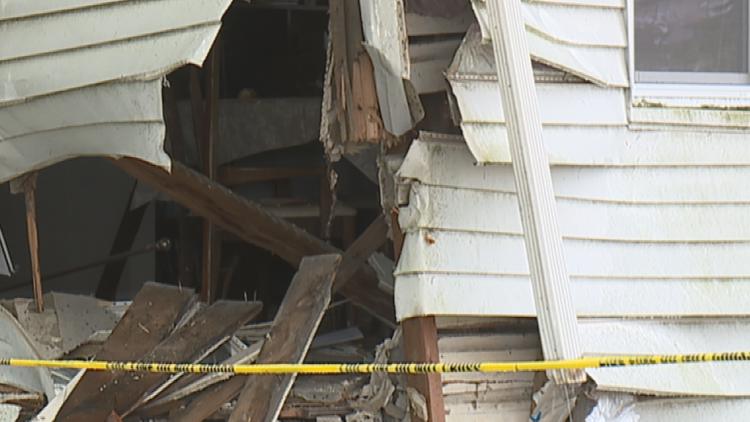 2 injured after vehicle crashes into house, overturns