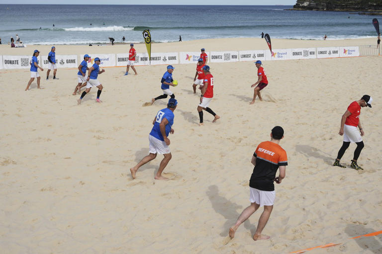 Australian friends claim world record for longest beach touch rugby game