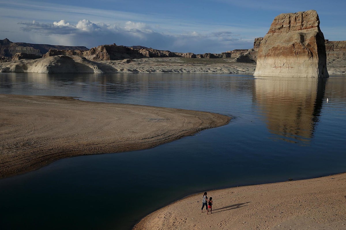 Low water levels at popular beach reveals truck containing human remains