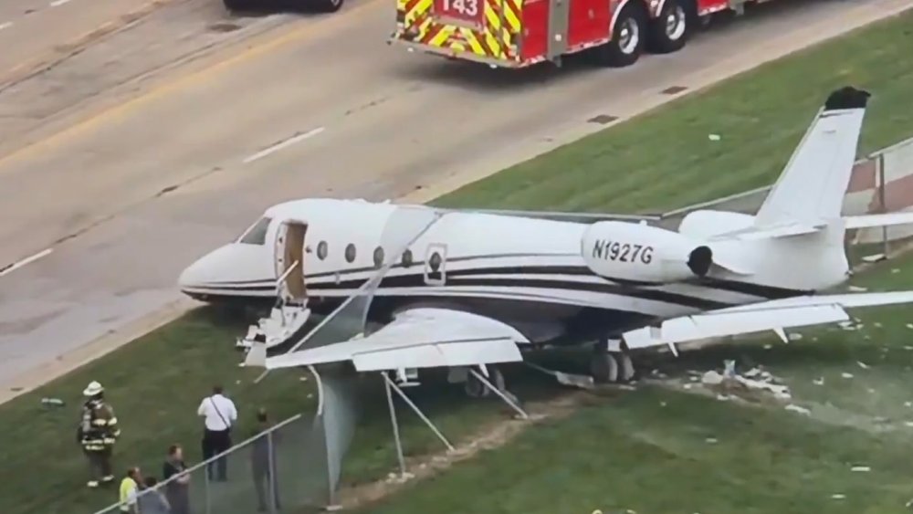 Private jet overshoots runway and crashes into fence