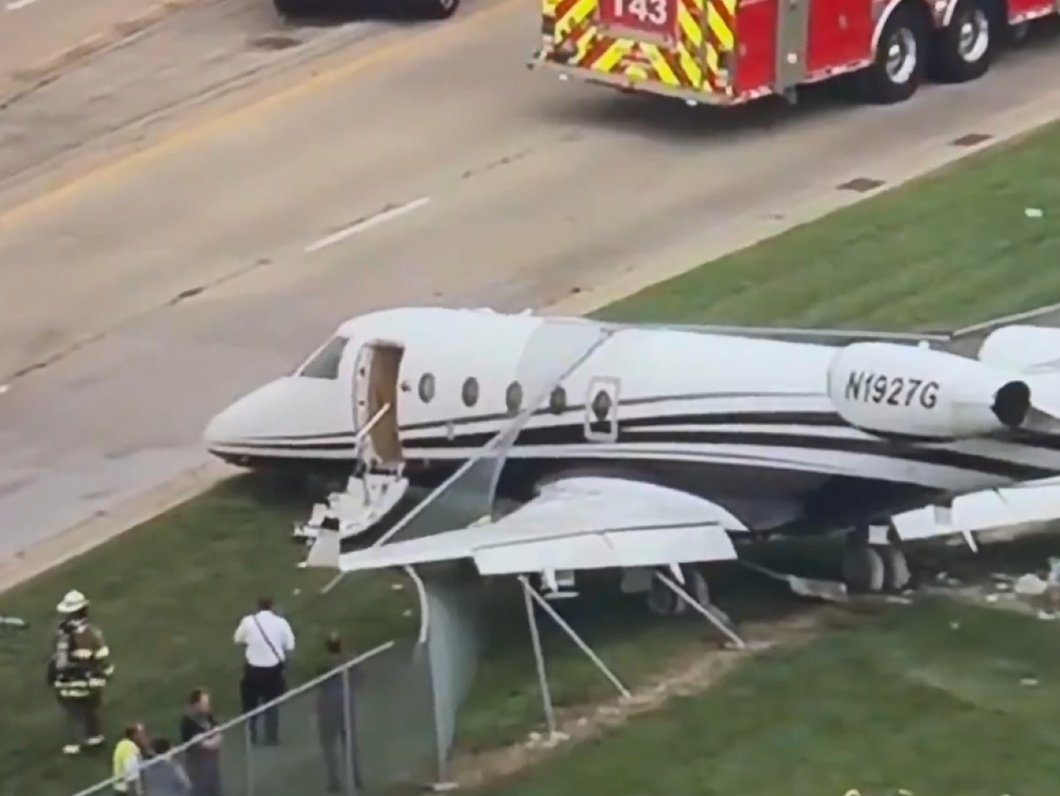 Private jet overshoots runway and crashes into fence