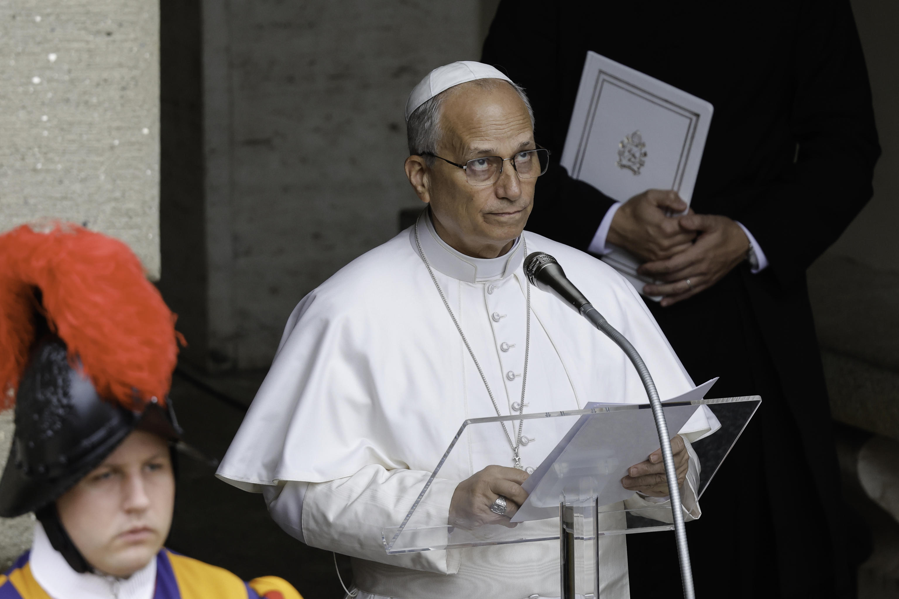 Pope feeds fish and jokes, 'Is anyone hungry?'