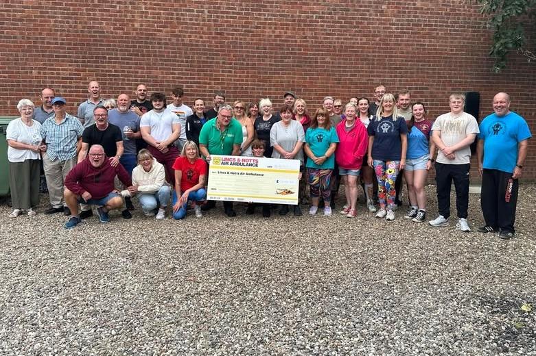 Powerlifting club marks 10 years of fundraising with a £1,335 donation