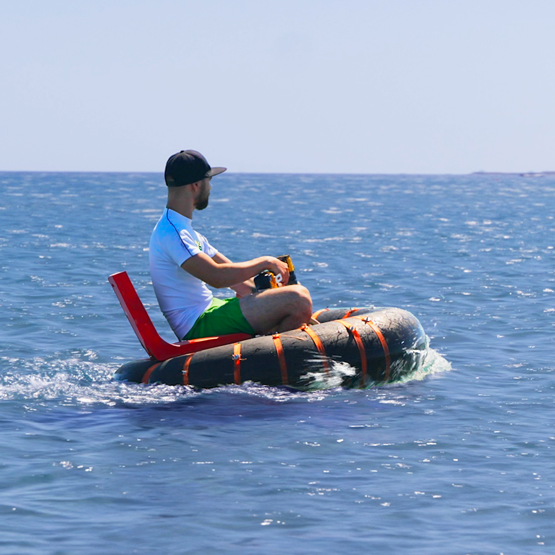 That's insane! He made a boat from a tire inner tube that goes so fast!