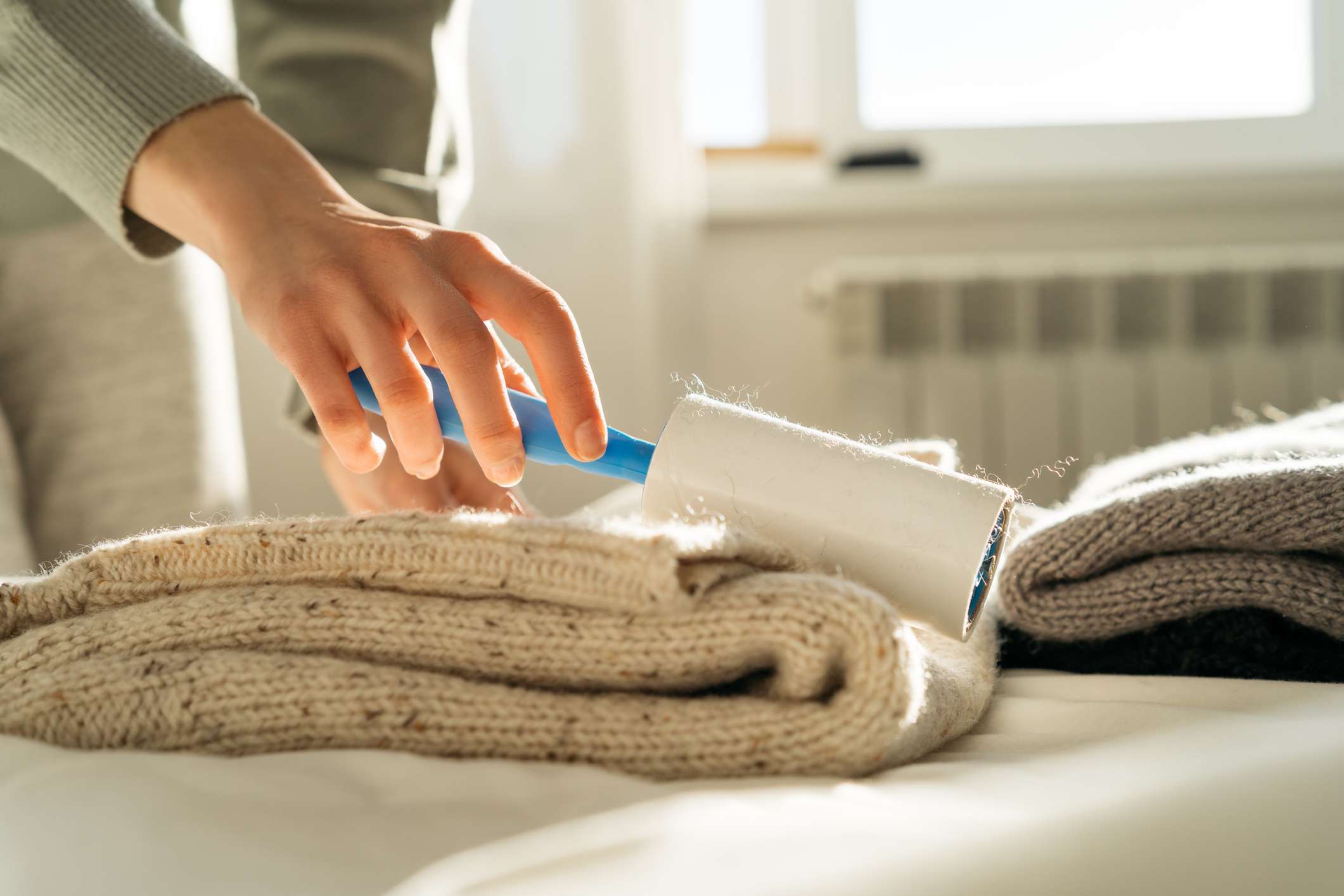 How to Get Rid of Lint on Clothes Fast (and Prevent It in the First Place)