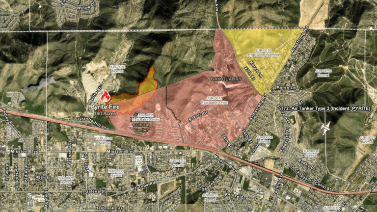 Evacuation orders issued as fast-moving wildfire burns in Riverside County