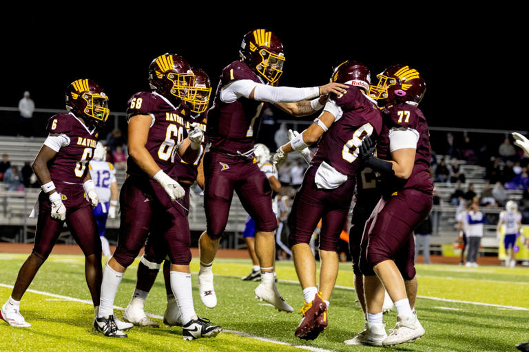 PHOTOS: Davison battles Warren De La Salle in tough high-flying ...