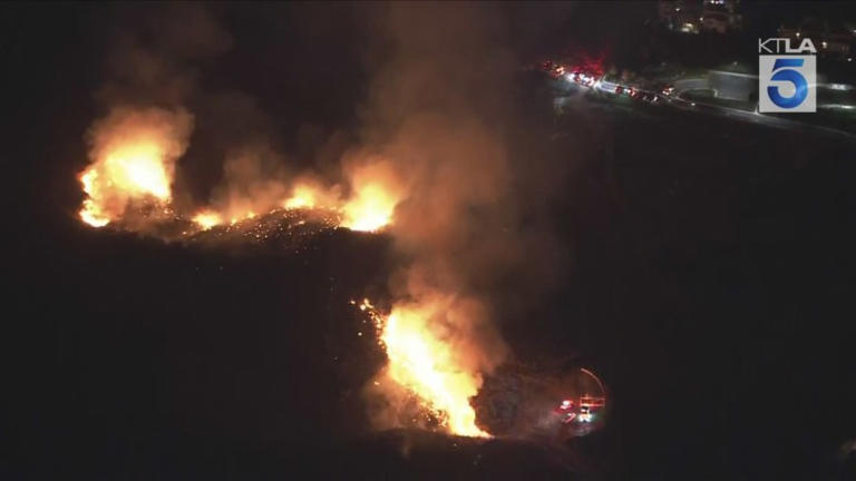 Evacuation orders issued as fast-moving wildfire burns in Riverside County