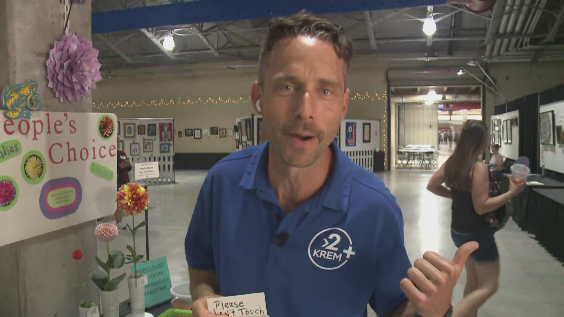 Chief meteorologist Jeremy Lagoo shows Spokane County Interstate Fair