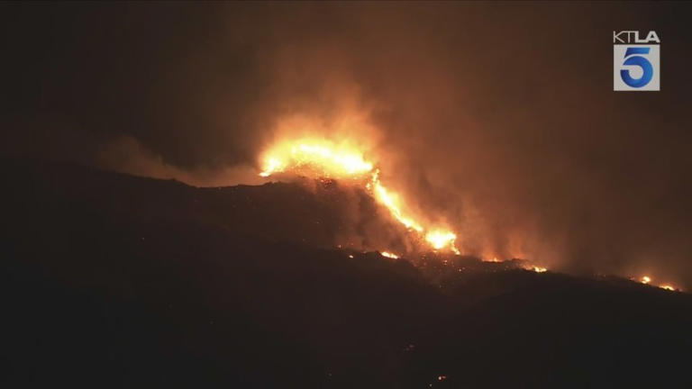 Evacuation orders issued as fast-moving wildfire burns in Riverside County