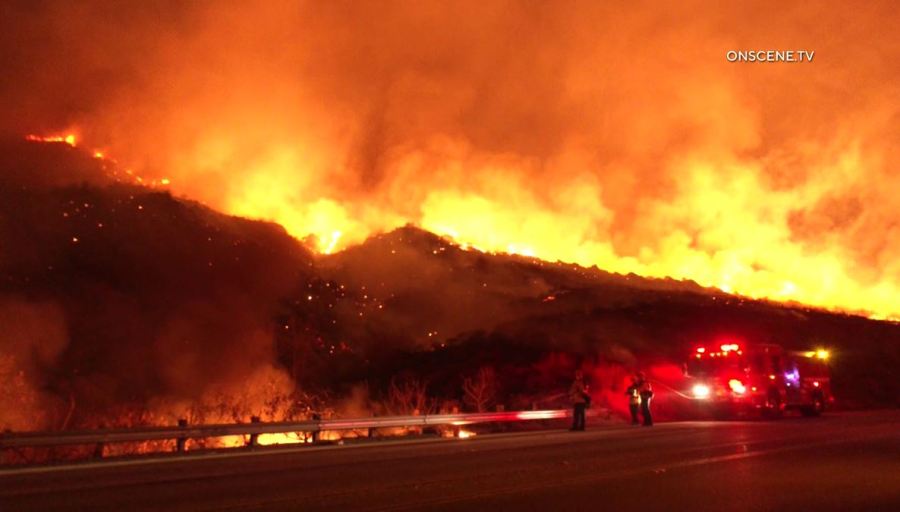 Evacuation orders issued as fast-moving wildfire burns in Riverside County