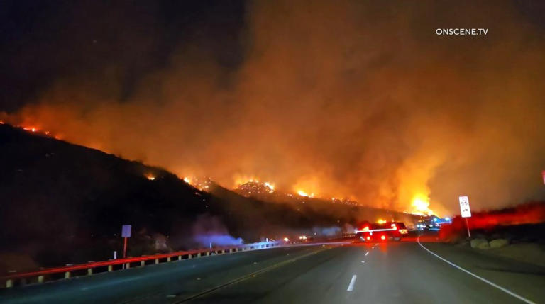 Evacuation orders issued as fast-moving wildfire burns in Riverside County