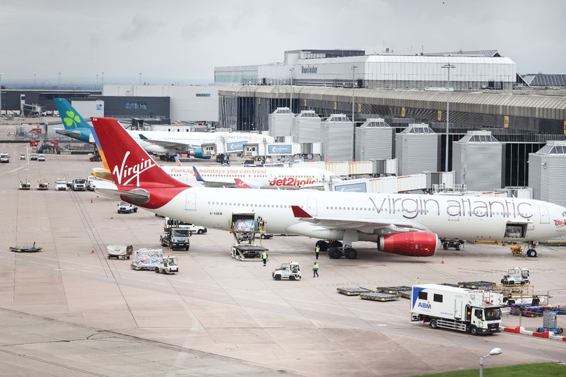 Manchester Airport flight grounded after woman 'tries to open emergency ...