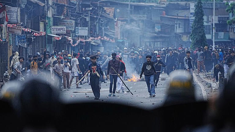 Students clash with riot police in Jakarta over MPs’ housing benefits