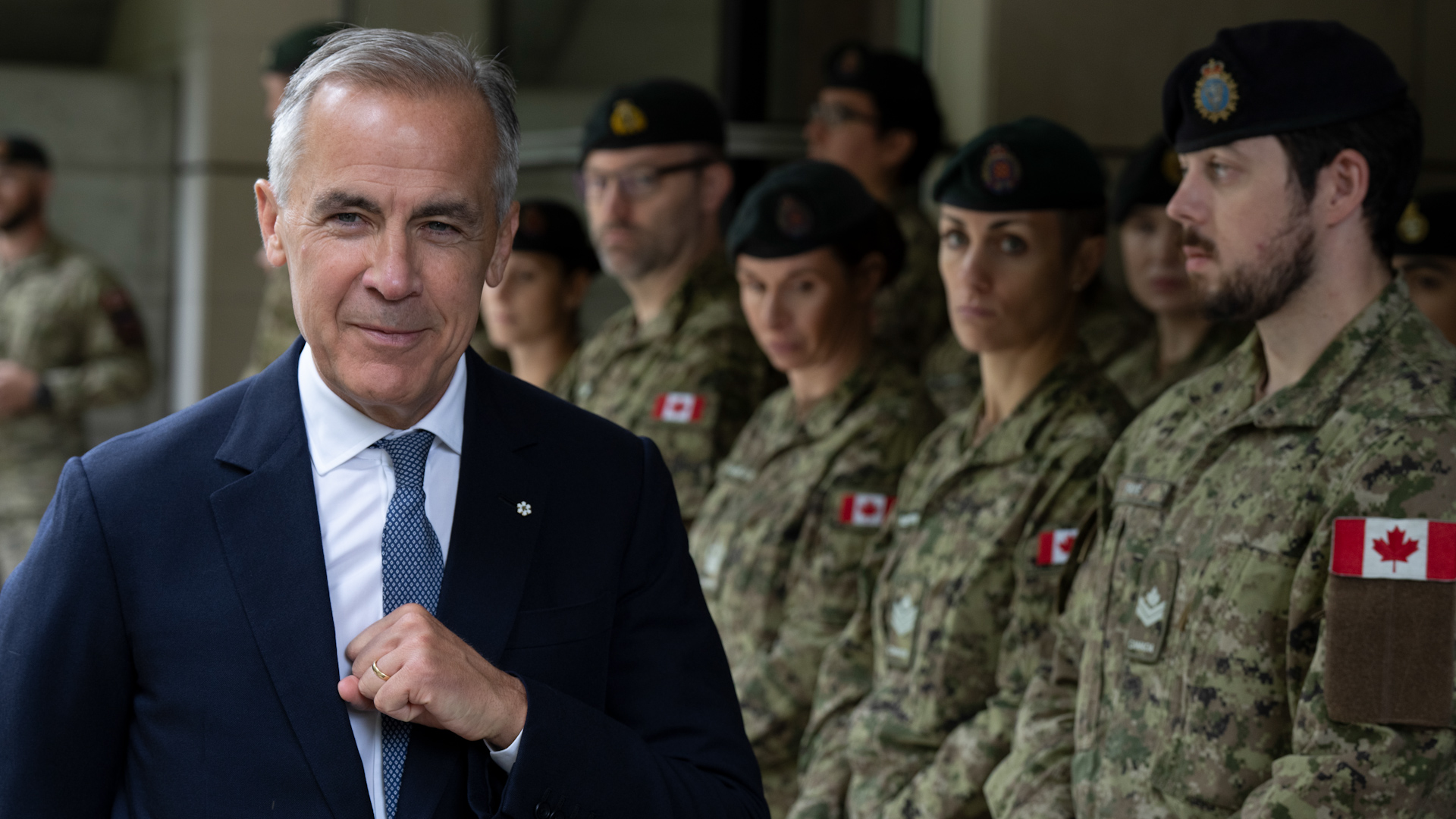 Carney, McGuinty meet Canadian troops in Poland