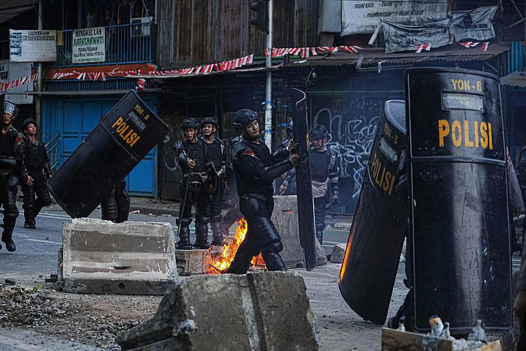 Riot police and students clash during protest against MPs' allowances ...