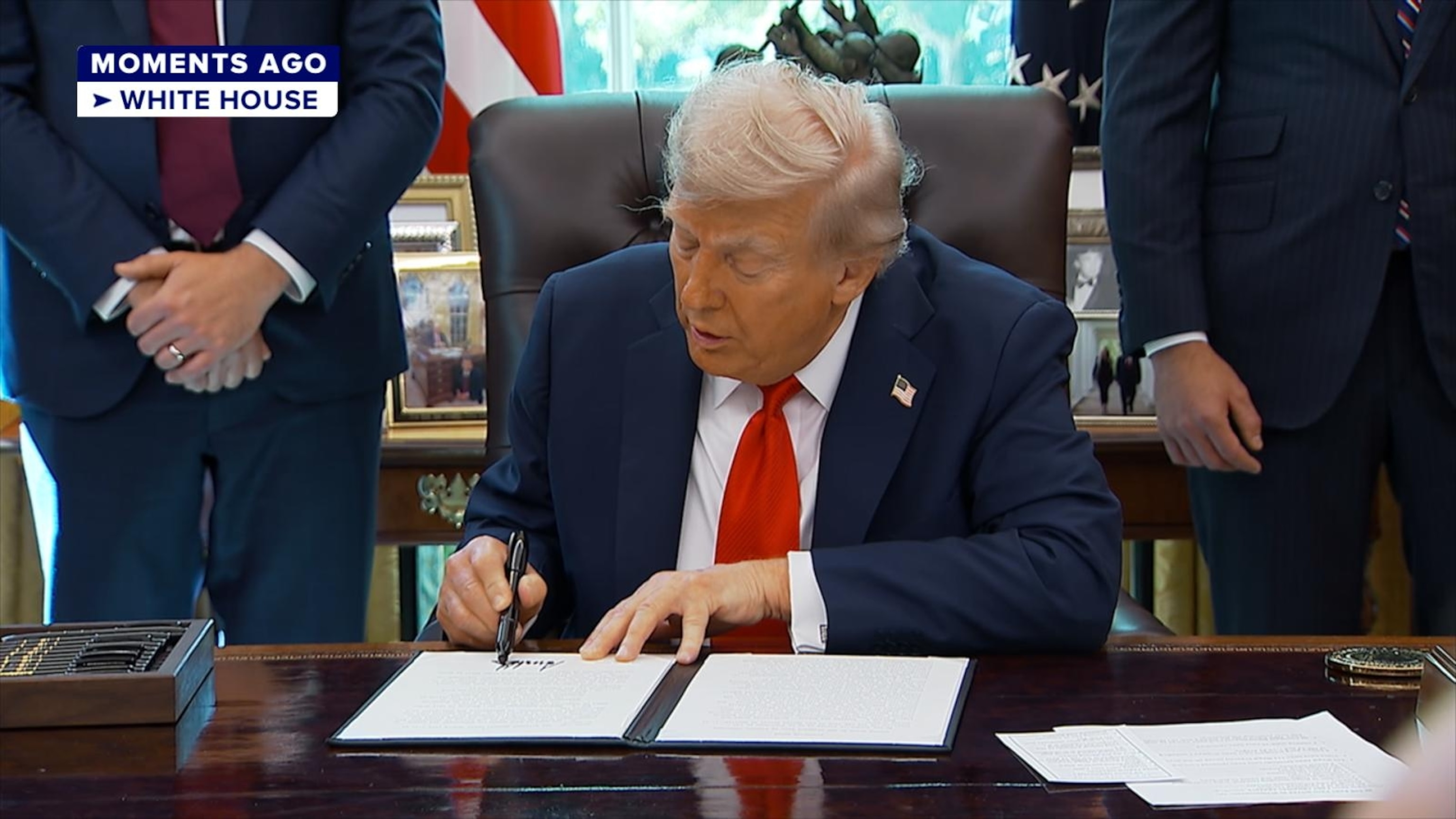 Trump signs orders targeting cashless bail, flag burning