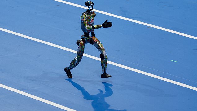 Running robot crashes into man on athletics track