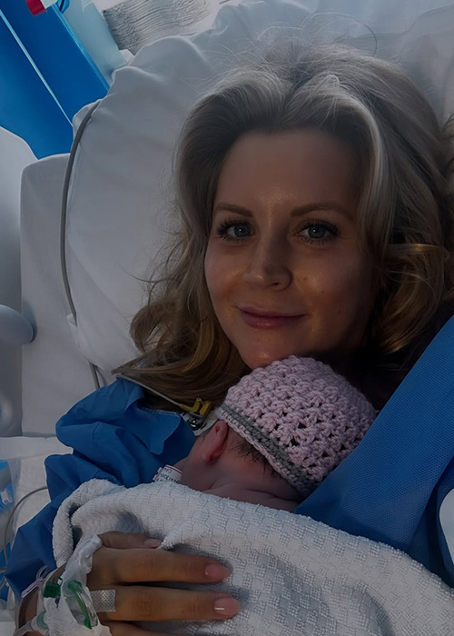 Pamela Laird and long-time love welcome 'perfect' baby on special day