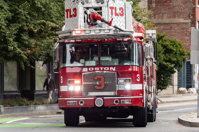 Boston firefighter held as dangerous after police find guns hidden in ...