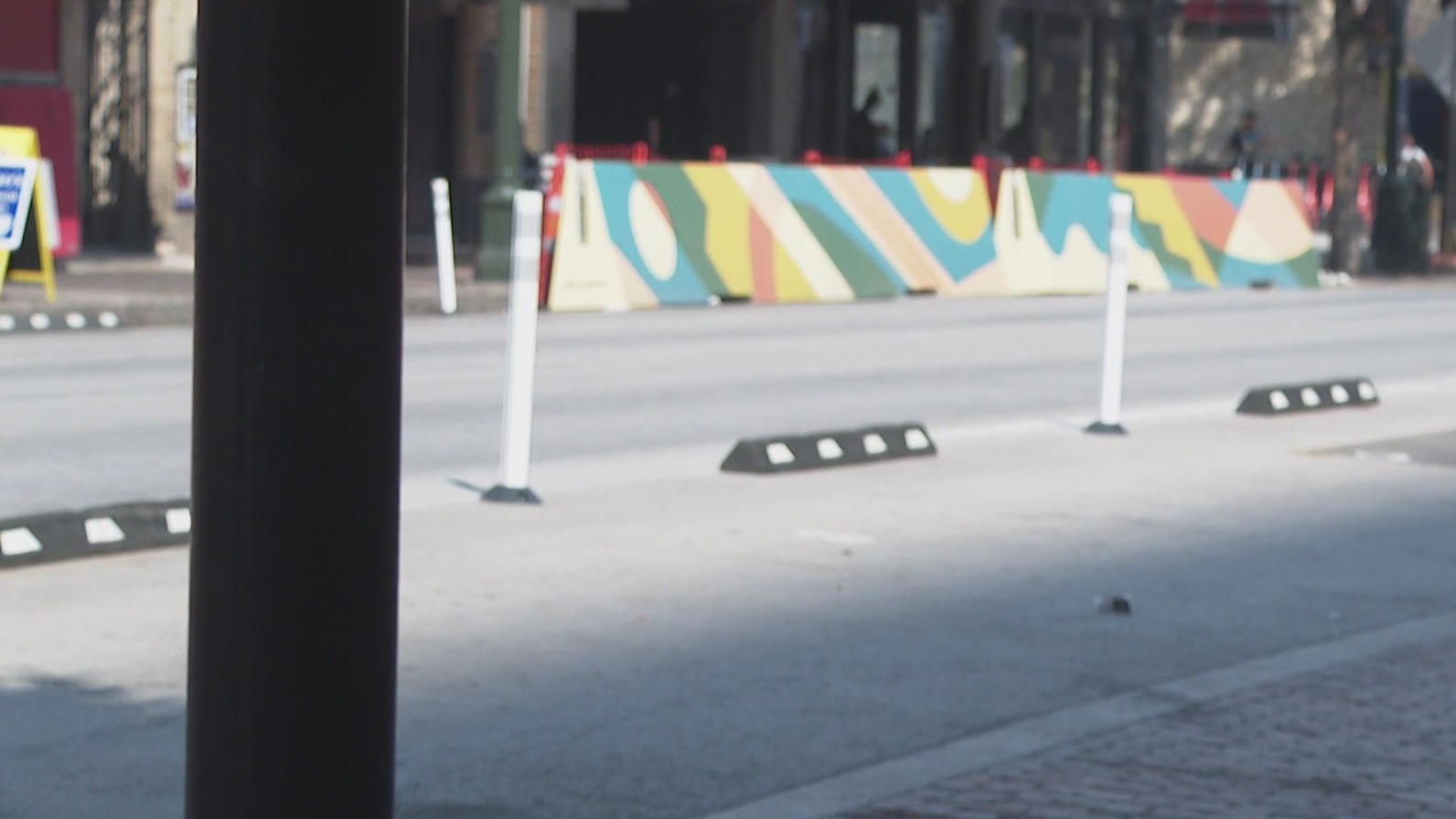 Painted concrete barriers now line part of Sixth Street