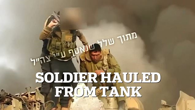 Moment Israeli soldier is hauled from burning tank and taken hostage