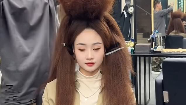 Stylist shapes woman's hair like actual reindeer antlers