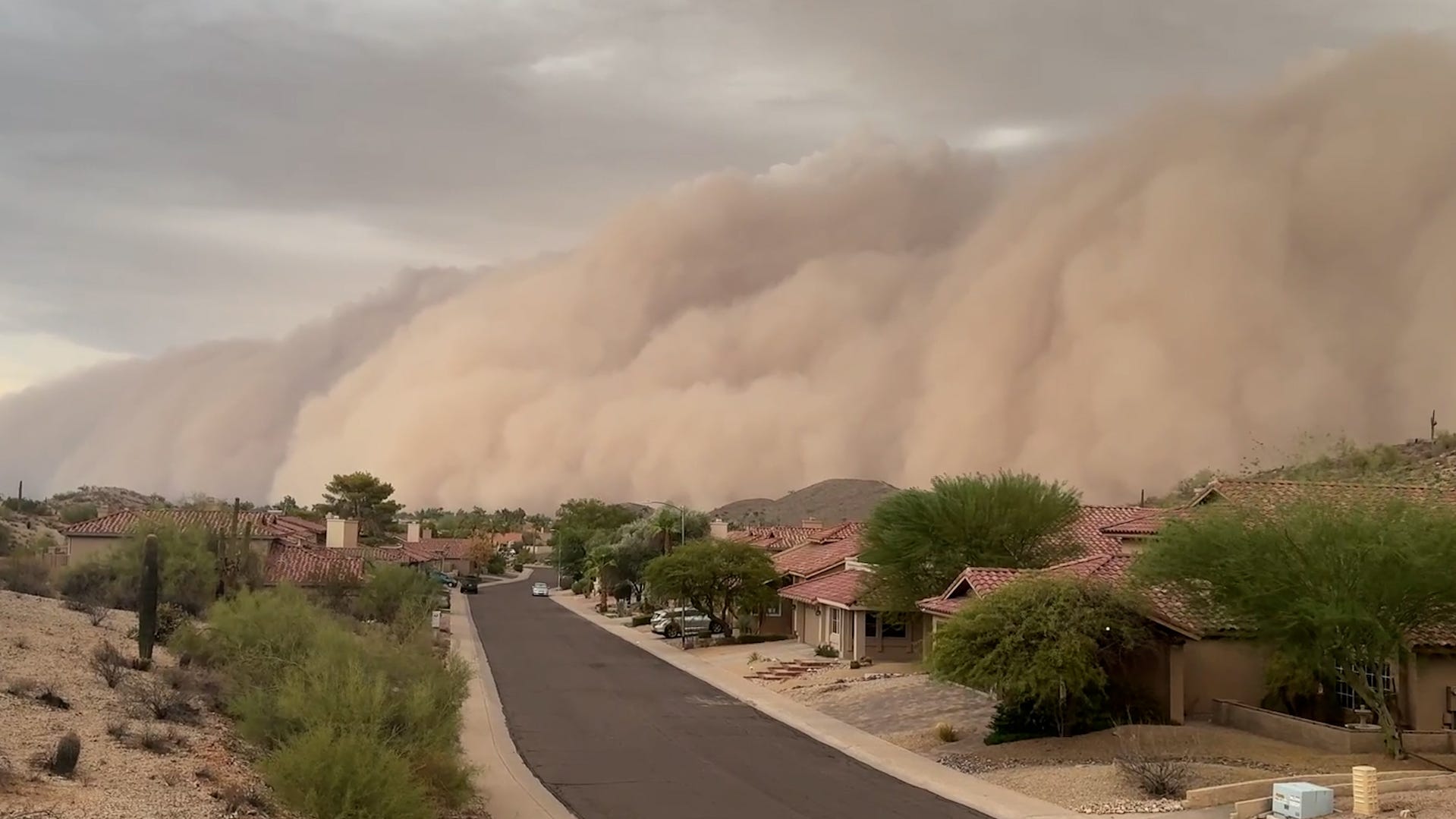 Watch as a towering dust storm looms over Phoenix