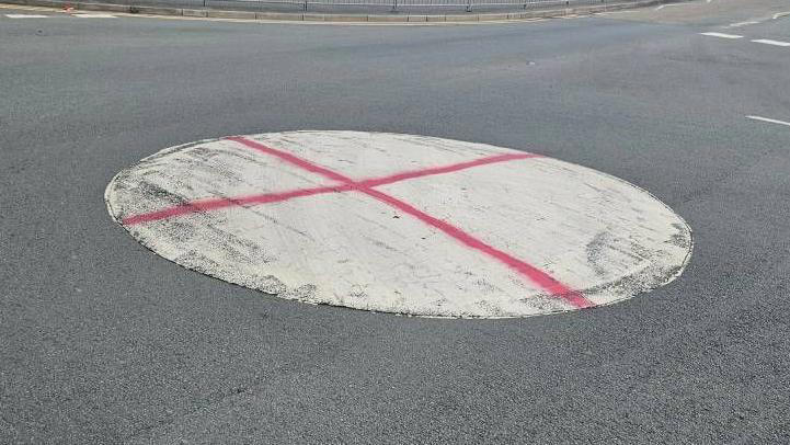 Police investigate England flag 'graffiti' on roundabout
