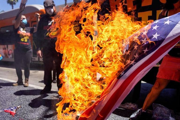 Trump Signs Executive Order Targeting Flag Burning—Here’s What The ...