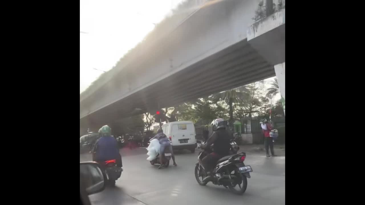 Overloaded motorbike spotted on road in Penang Island, Malaysia