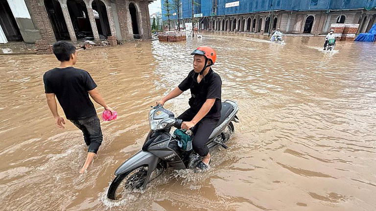 At least eight dead after heavy rain causes flooding and landslides in ...