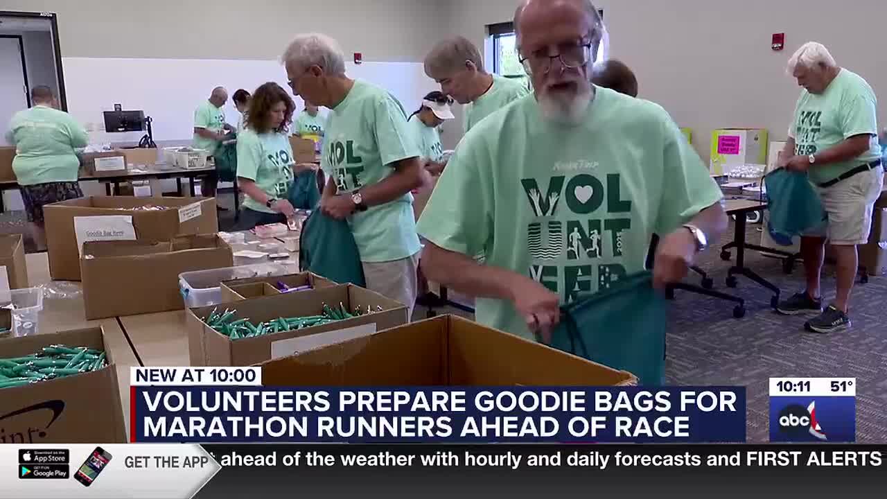 Volunteers prepare goodie bags for marathon runners ahead of race