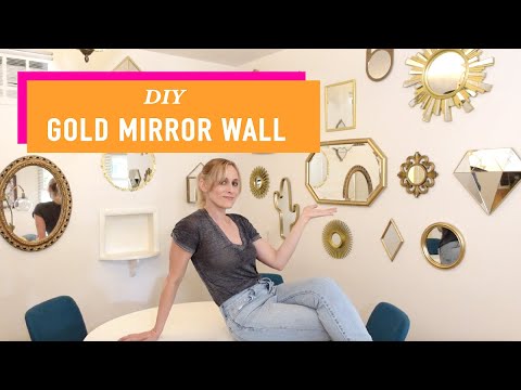 Create a statement-gold mirror wall for your dining space